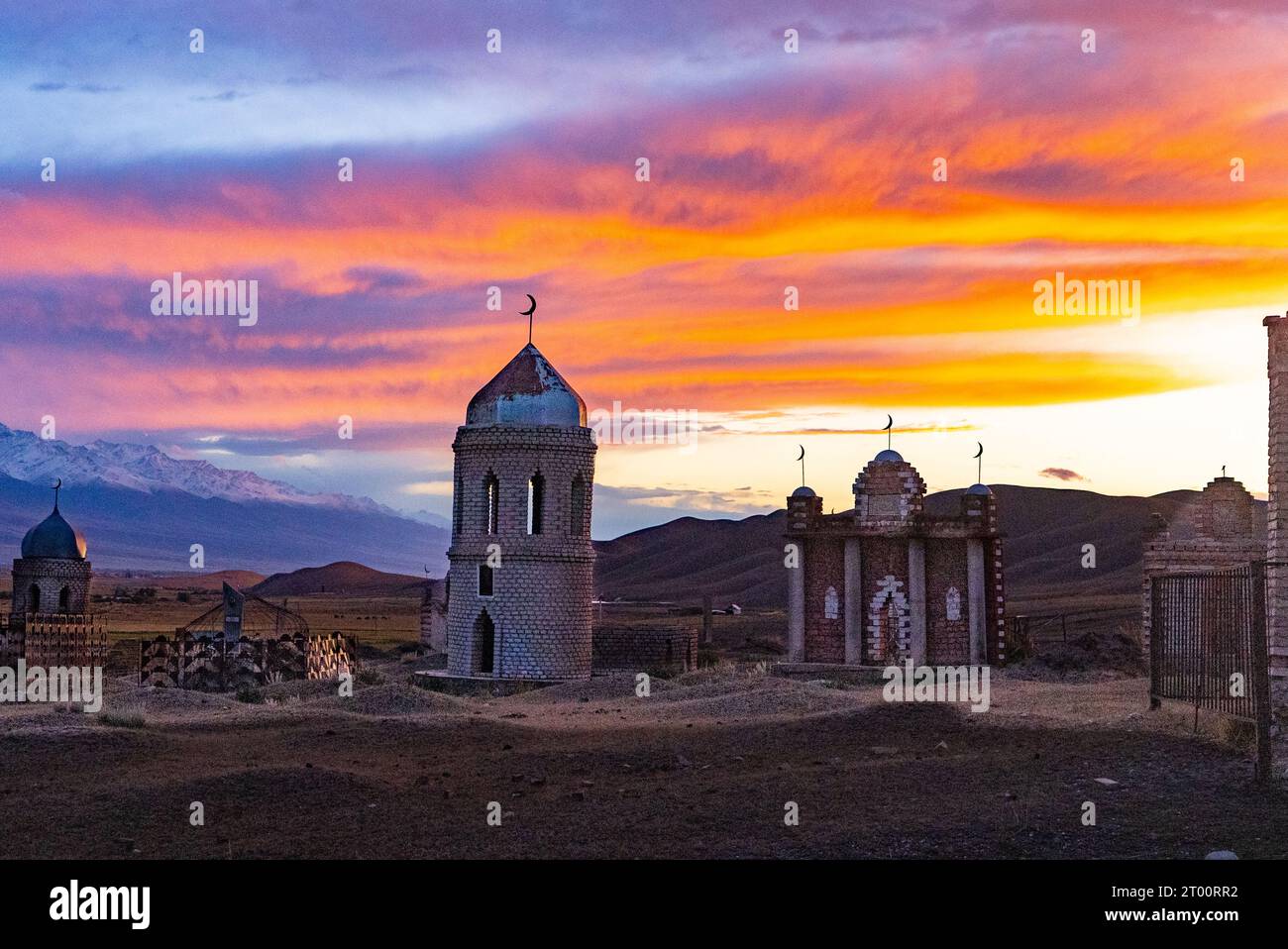 Traditional Muslim cemeteries outside villages in Kyrgyzstan Stock ...