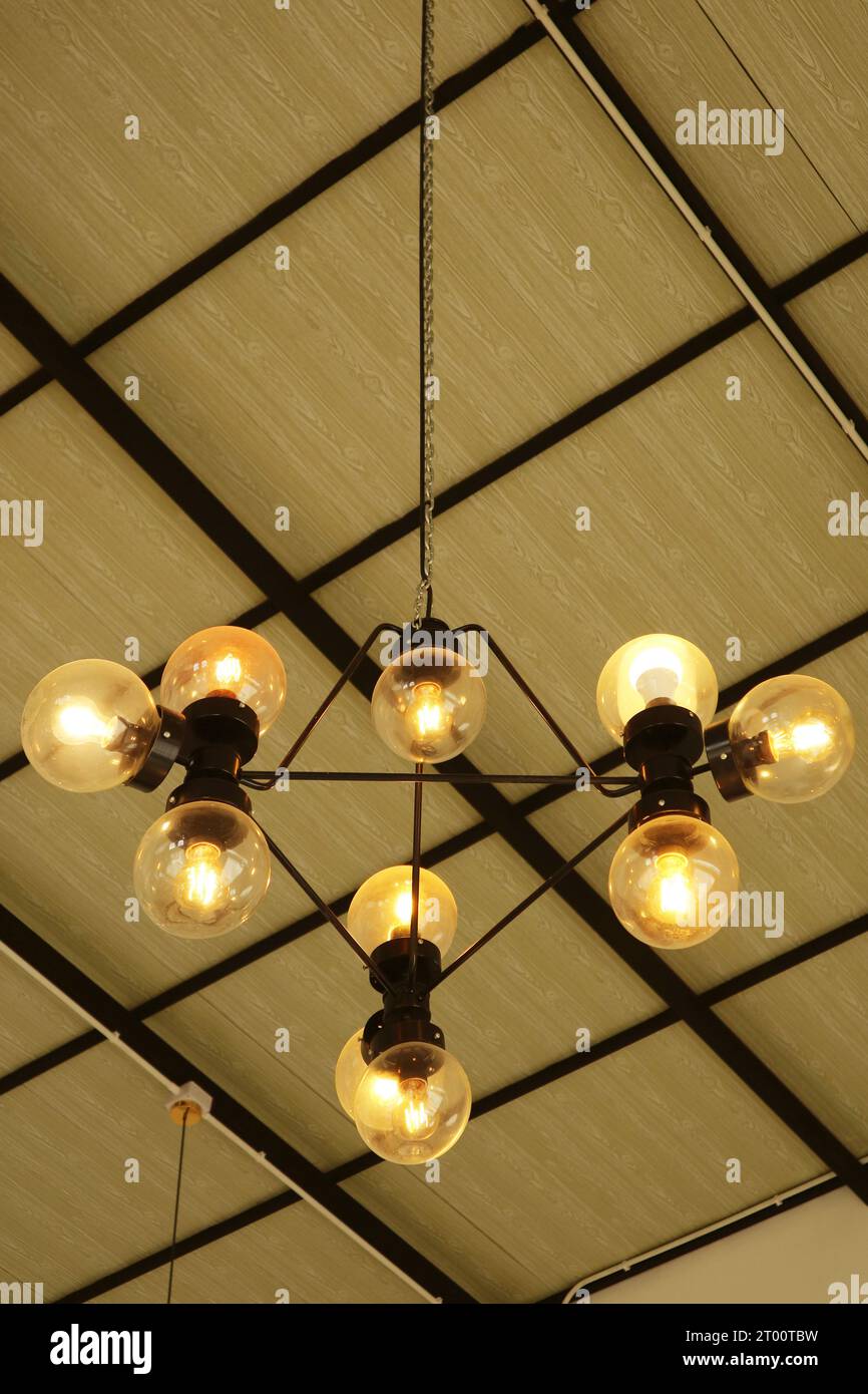 Ceiling pendant lighting with sphere shaped glass shade Stock Photo - Alamy