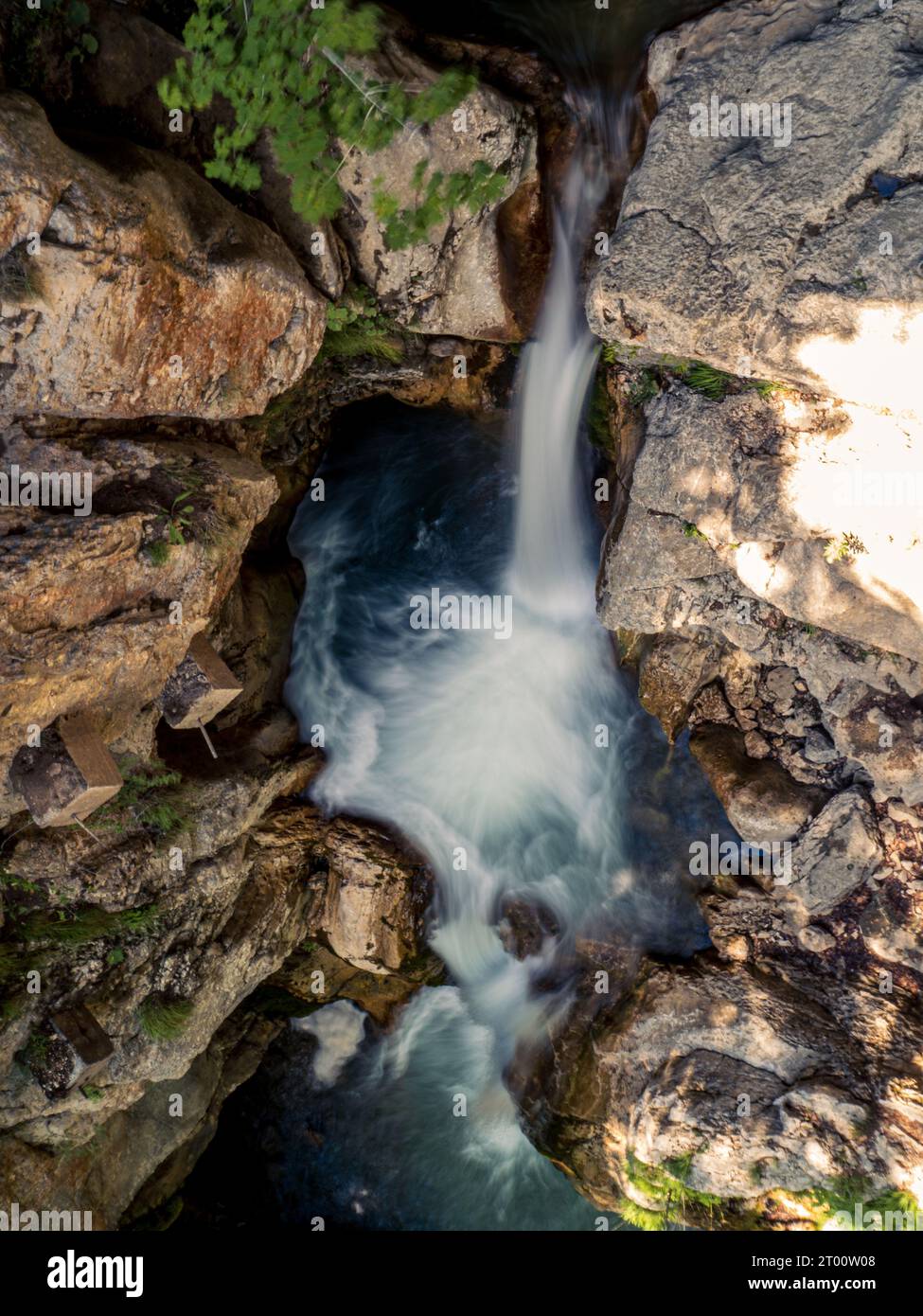 Top down aerial view long exposure shot of a waterfall at ...