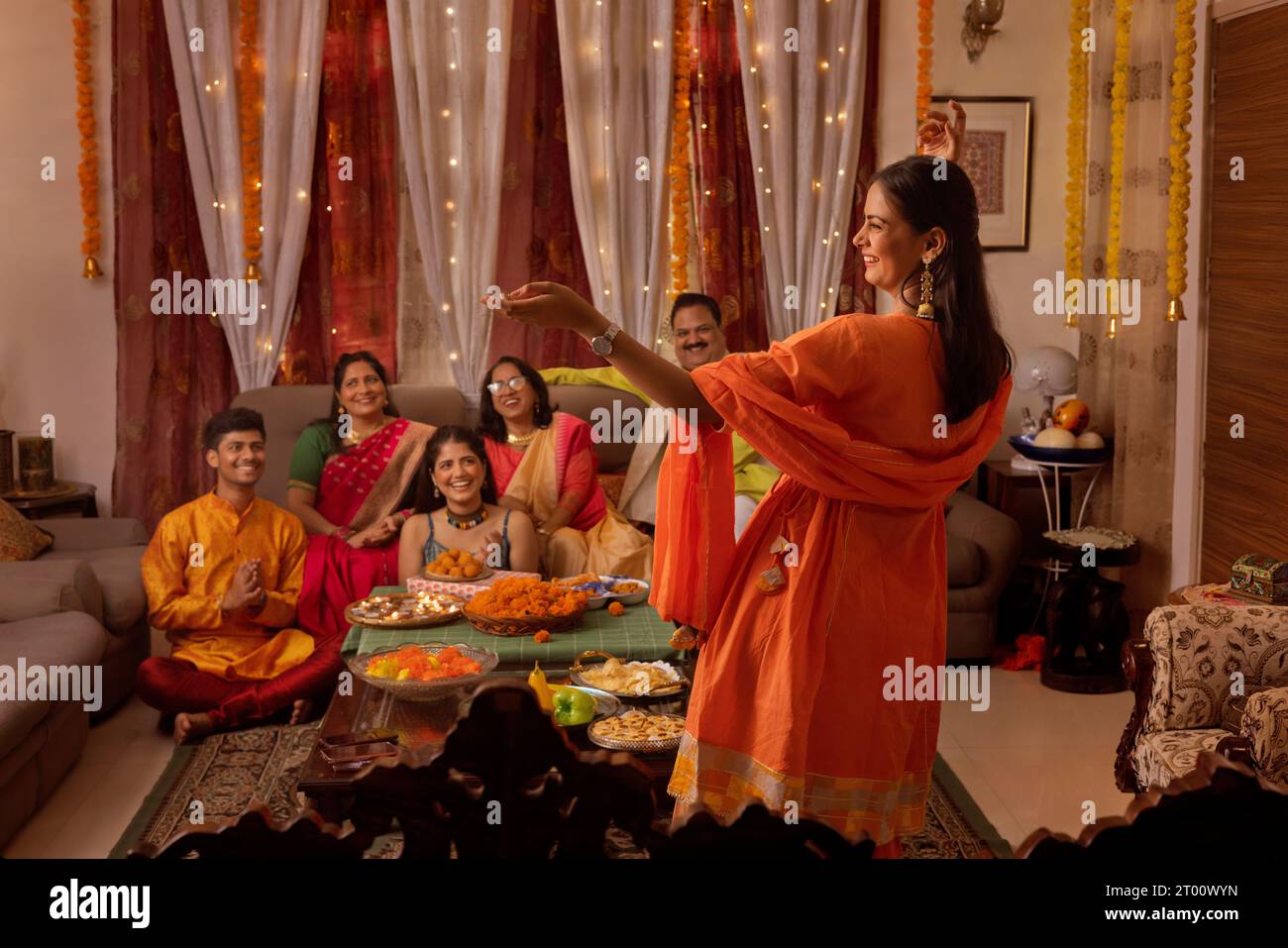 Family having fun together at home on the occasion of Diwali Stock ...