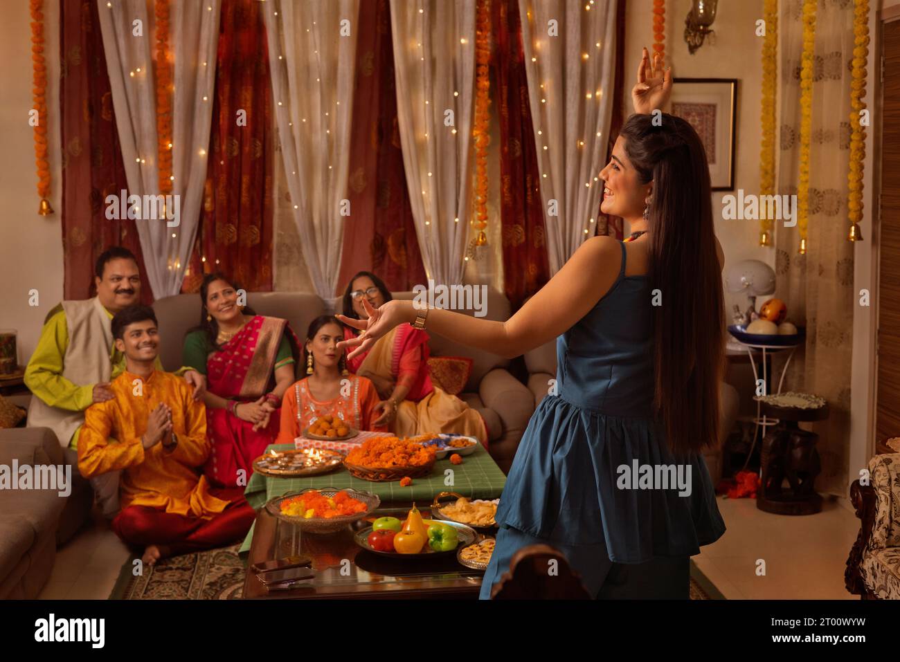 Family having fun together at home on the occasion of Diwali Stock ...