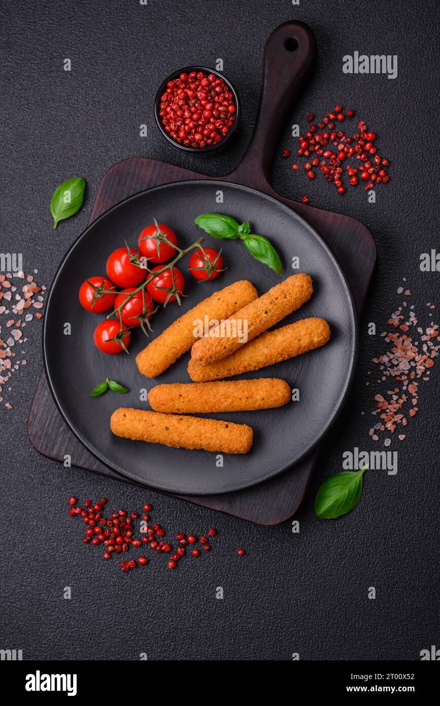 Delicious crispy cheese sticks with mozzarella, salt and spices ...