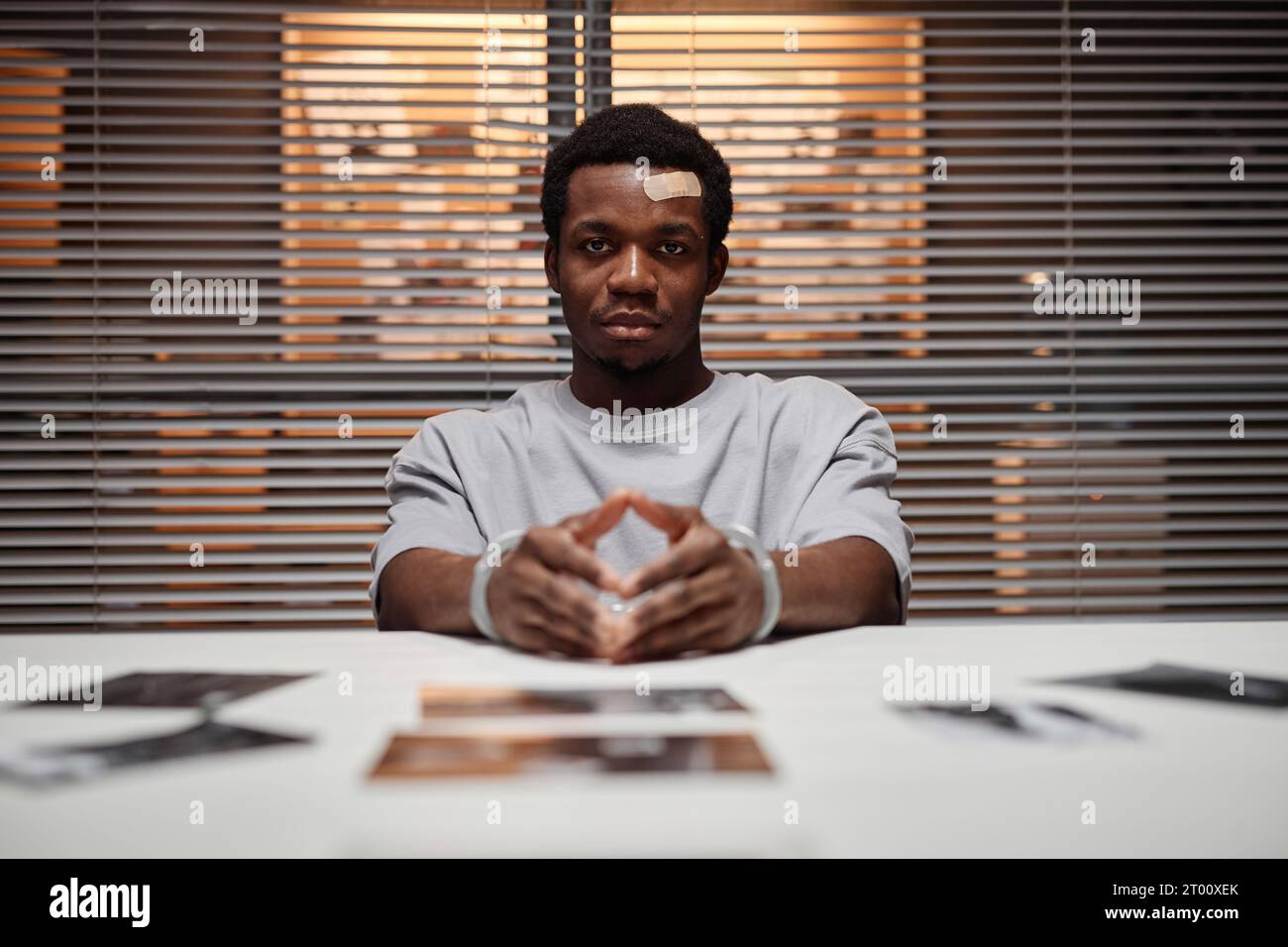 Criminal crime smiling sitting punishment looking at camera hi-res ...