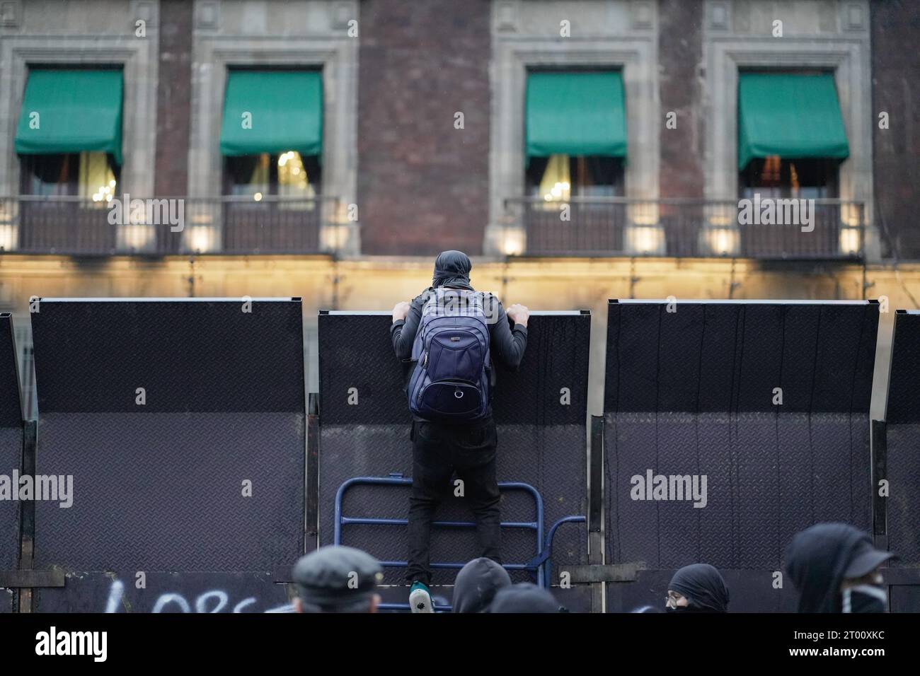 Mexico, Mexico. 02nd Oct, 2023. A protester tries to jump over the ...