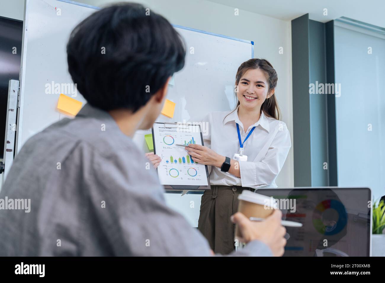 Business woman present business strategy plan to corporate colleagues ...