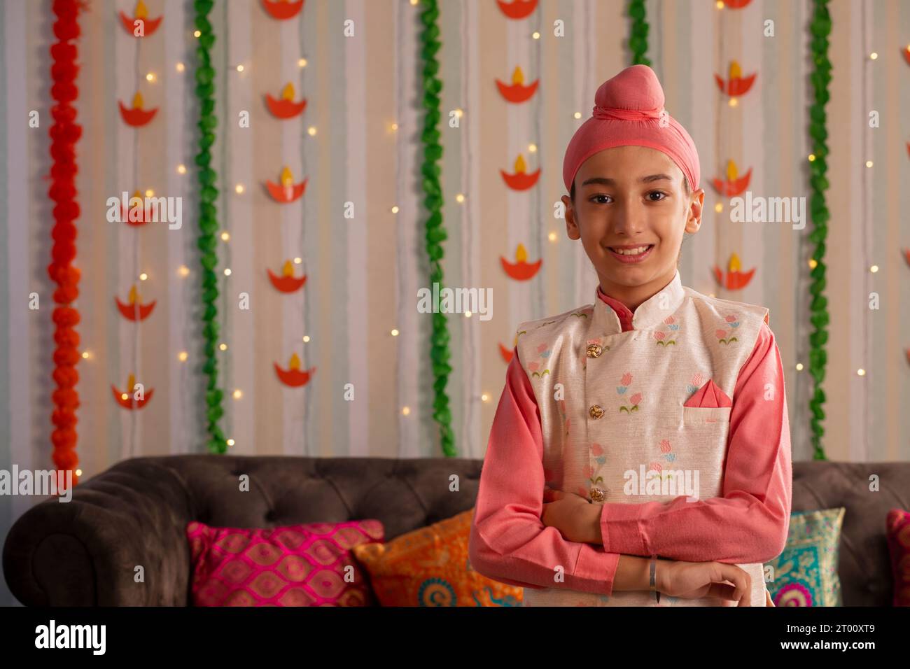 A Sikh boy standing and looking at camera on the occasion of Diwali ...