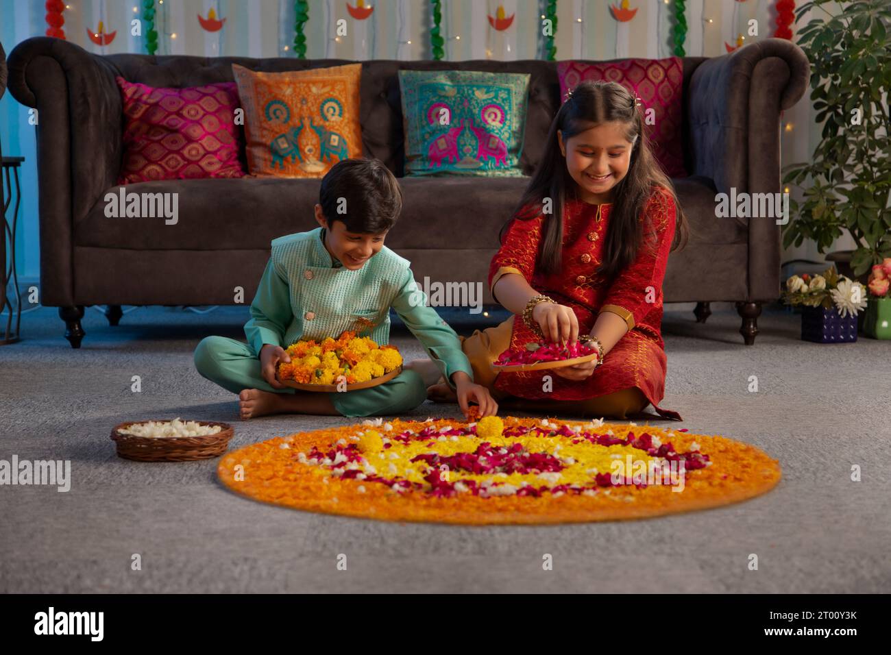 Children making floral rangoli on the occasion of Diwali Stock Photo ...