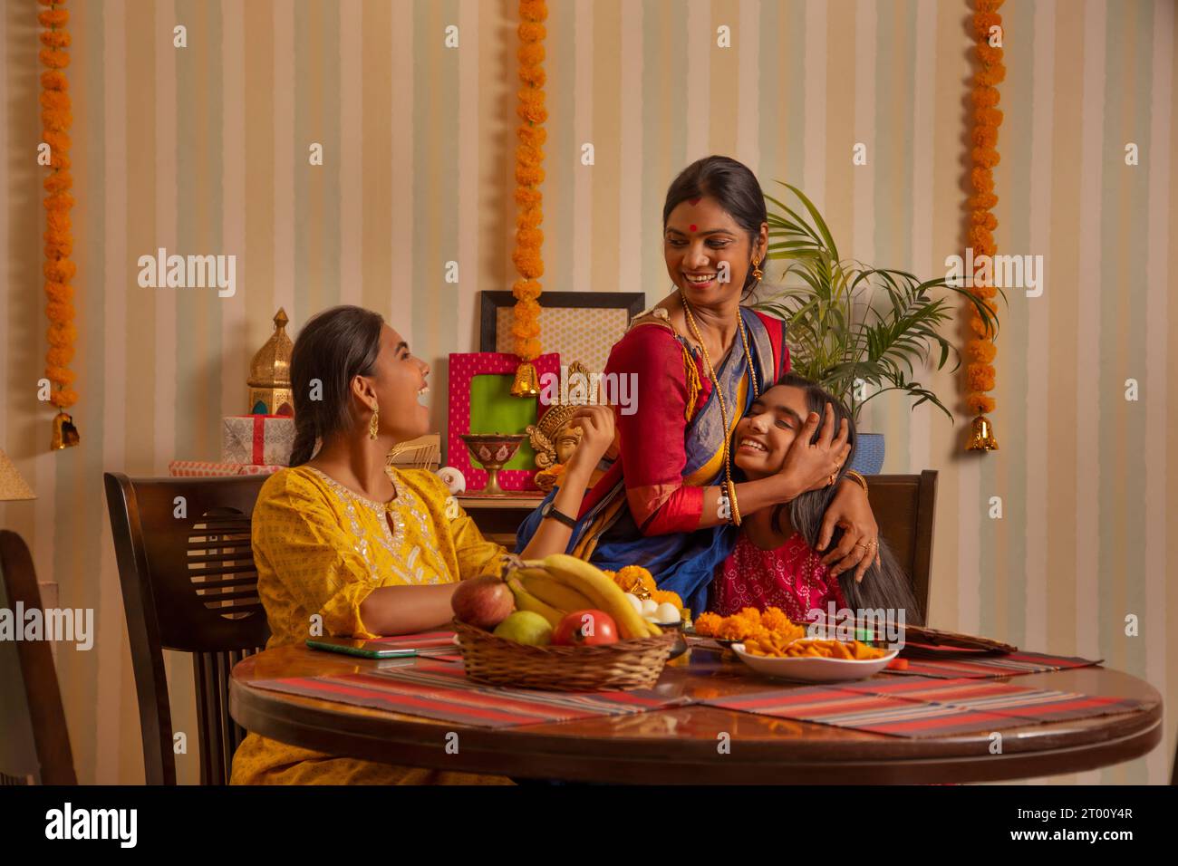 Portrait of Bengali family sitting together in the dining room Stock ...
