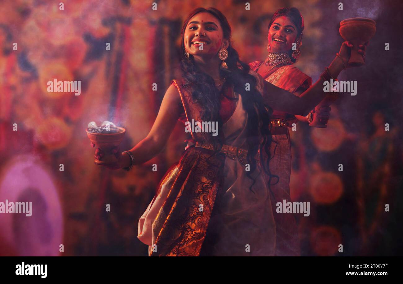 Bengali women performing dhunuchi dance on the occasion of Durga Puja ...