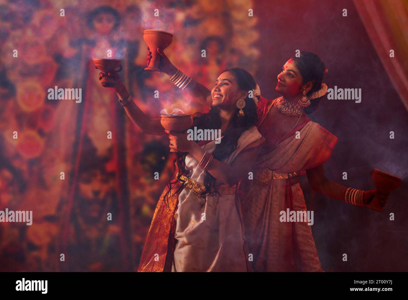 Bengali women performing dhunuchi dance on the occasion of Durga Puja ...