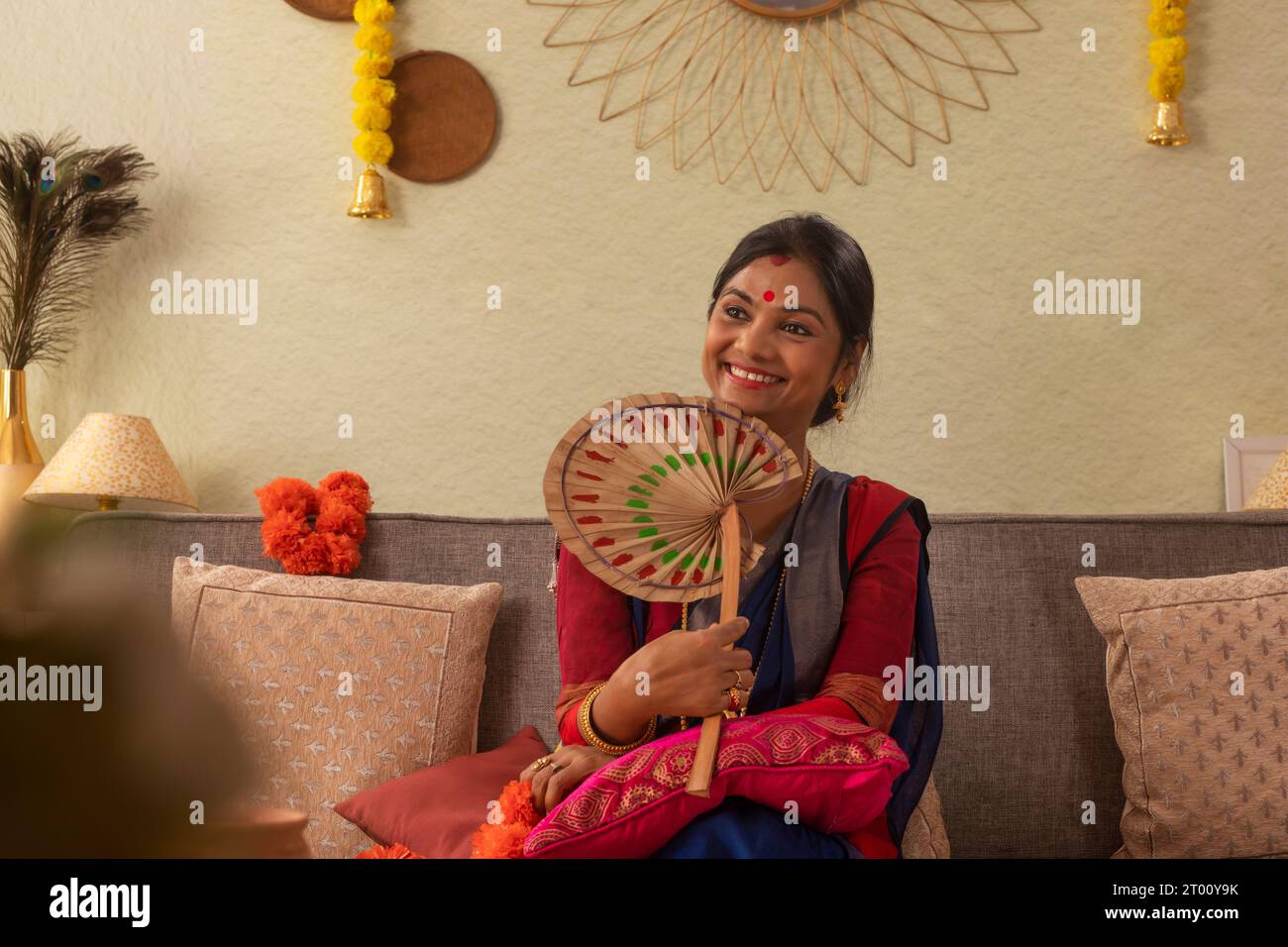 Indian hand holding fan indian hi-res stock photography and images - Alamy