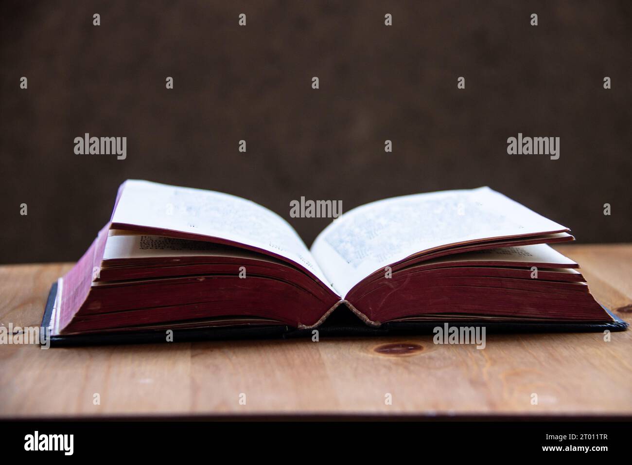 Old book open Stock Photo - Alamy