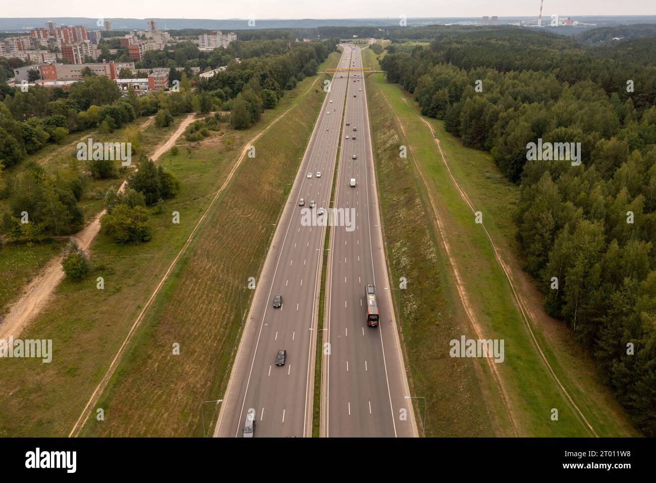 Drone photography of big highway near a city with traffic during cloudy ...