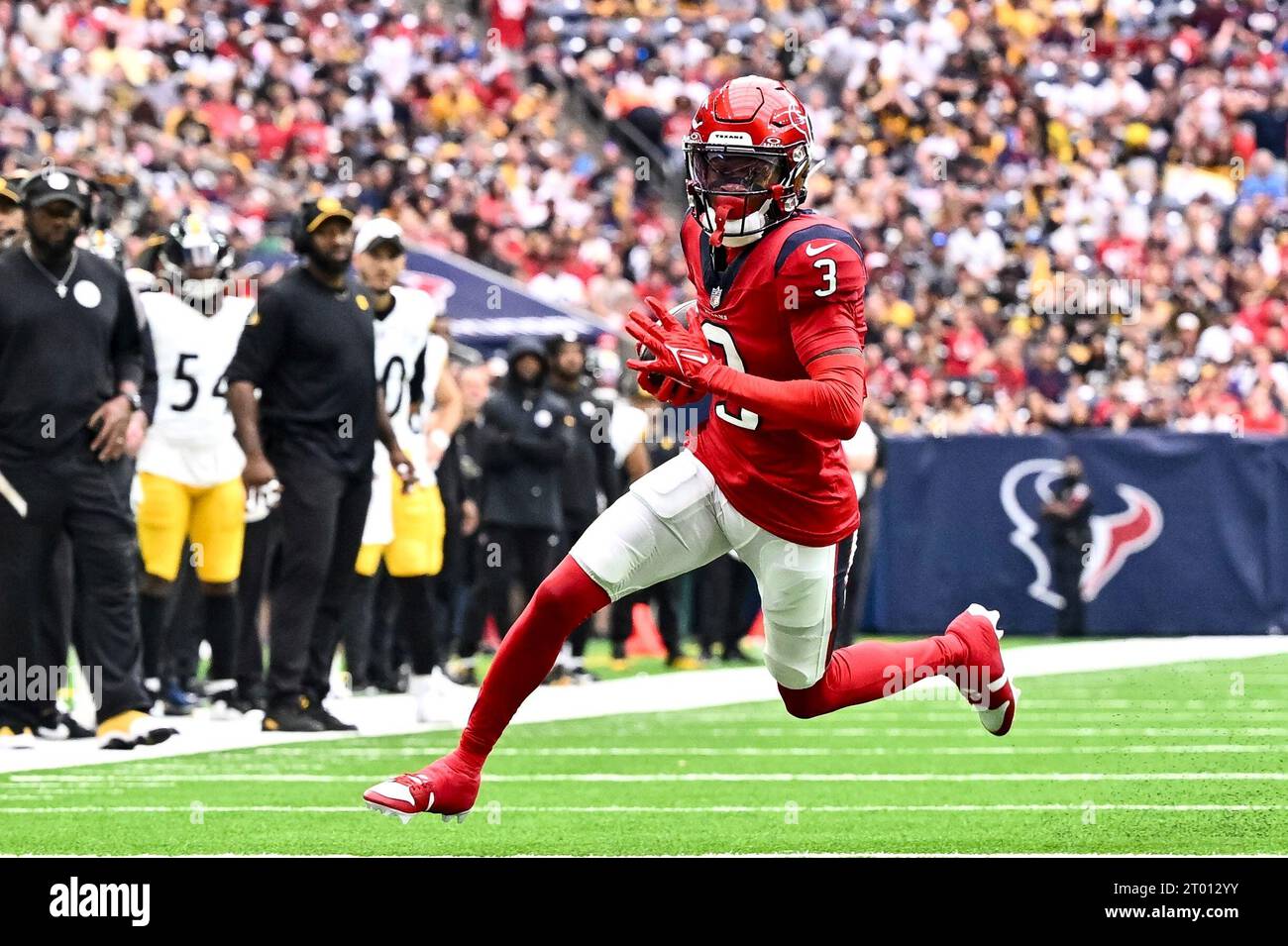 Houston Texans wide receiver Tank Dell (3) runs the ball in the first ...