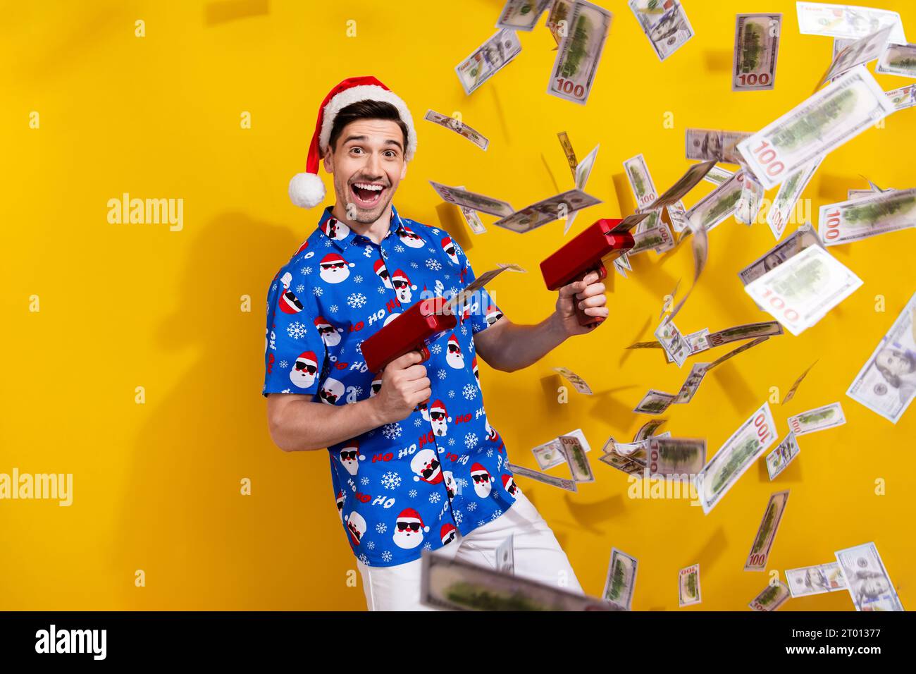 Portrait of crazy overjoyed person shooting dollar bills money gun ...