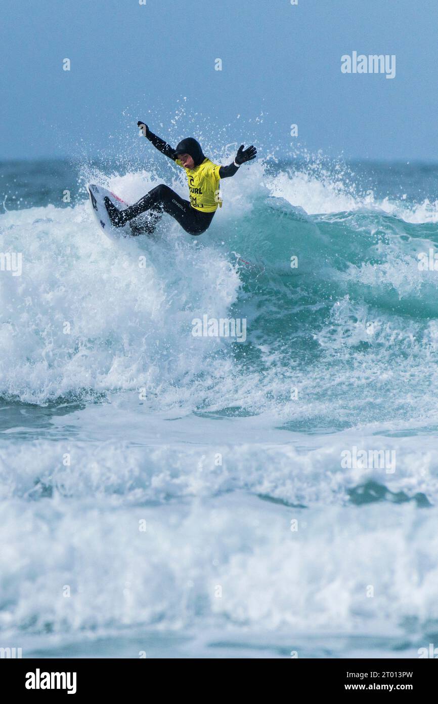 A view of a young male surfer riding a wave during the Rip Curl Grom ...