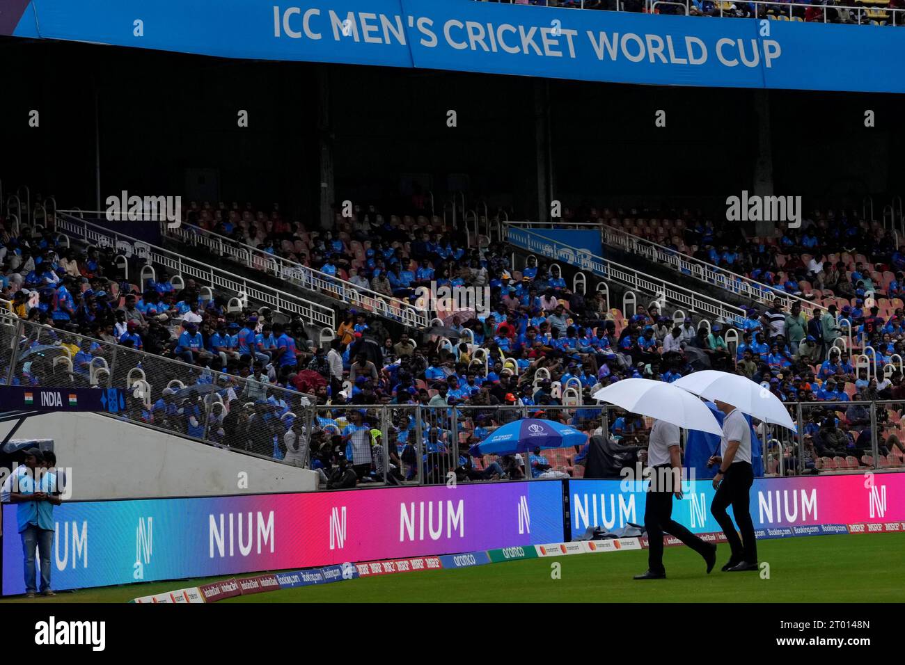 Umpires return after inspecting the ground and calling ICC Men's ...
