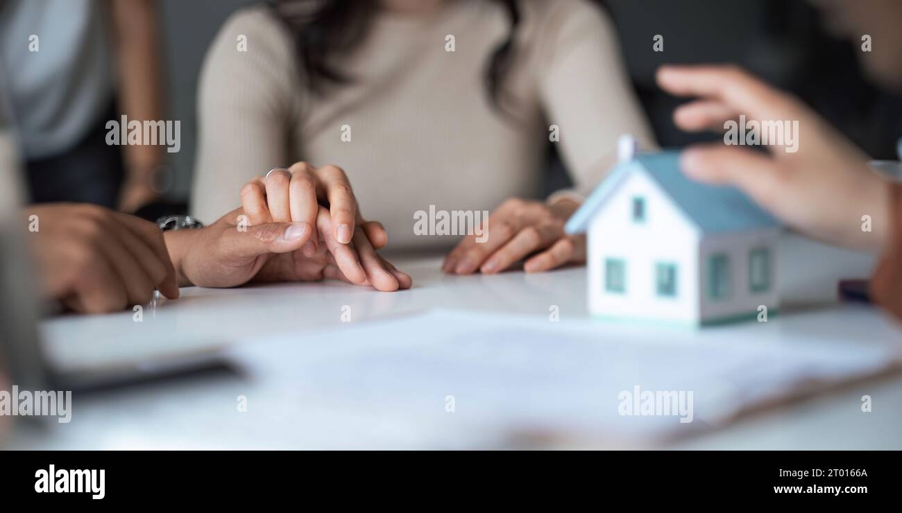 Young Asian couple making contract with house sale agency. man and his ...
