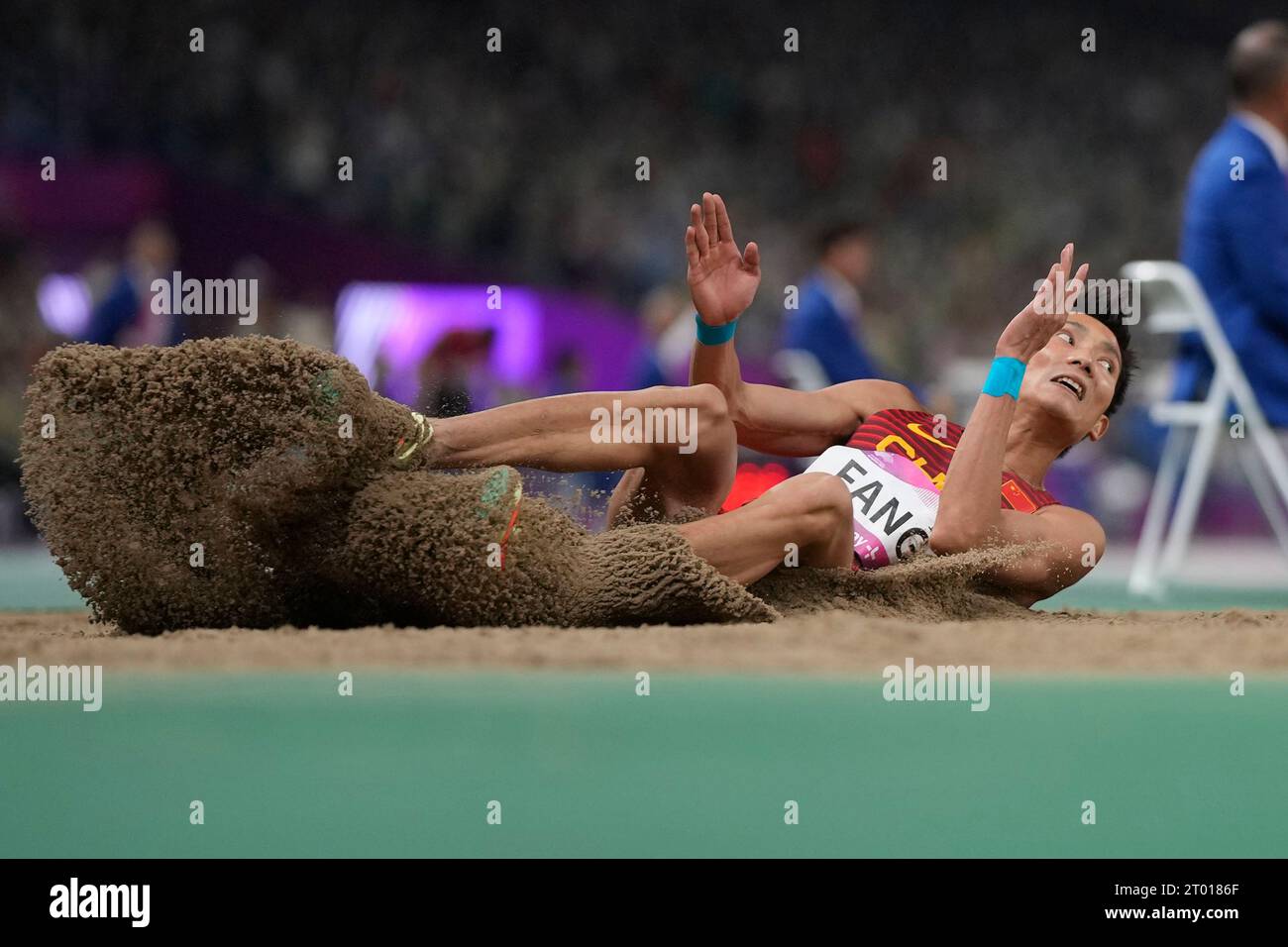 China's Fang Yaoqing competes during the men's triple jump final at the ...