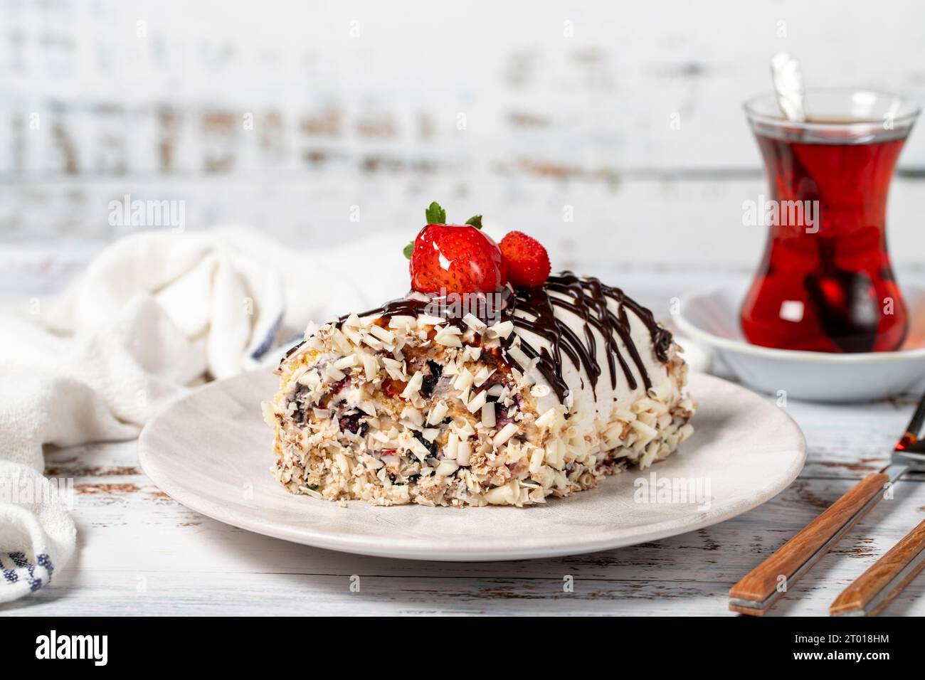 Strawberry log cake. Strawberries and cream cake on a white background ...