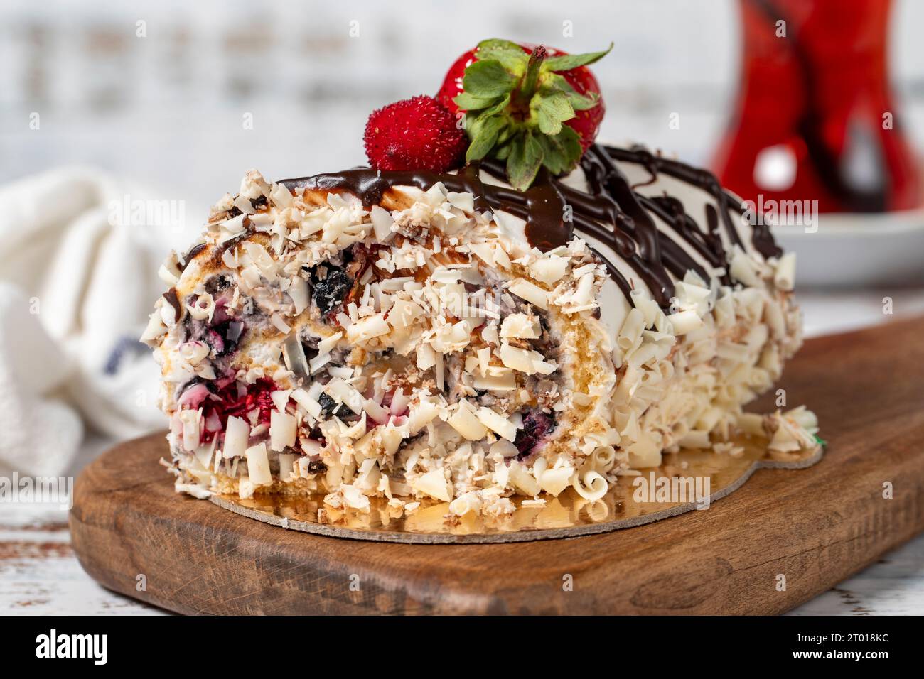 Strawberry log cake. Strawberries and cream cake on a white background ...
