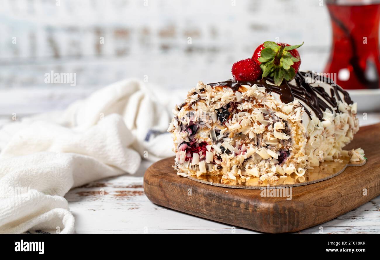 Strawberry log cake. Strawberries and cream cake on a white background ...