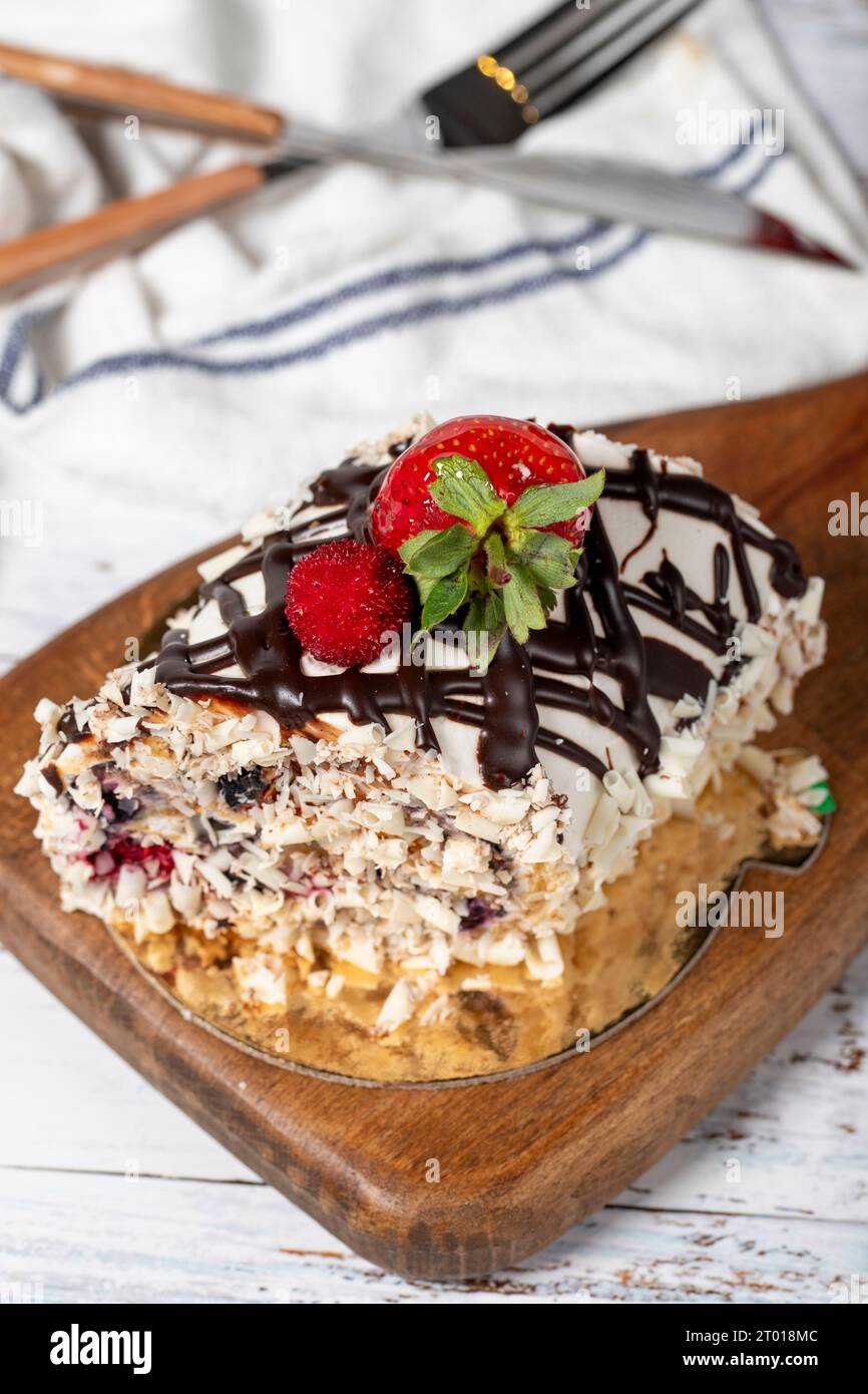 Strawberry log cake. Strawberries and cream cake on a white background ...