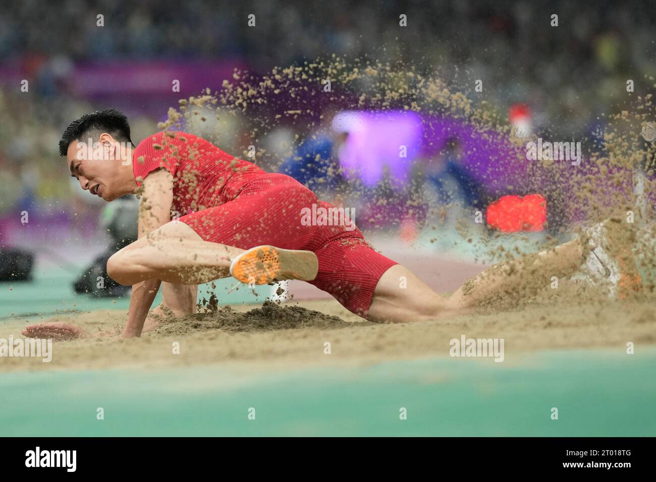 China's Zhu Yaming competes during the men's triple jump final at the ...