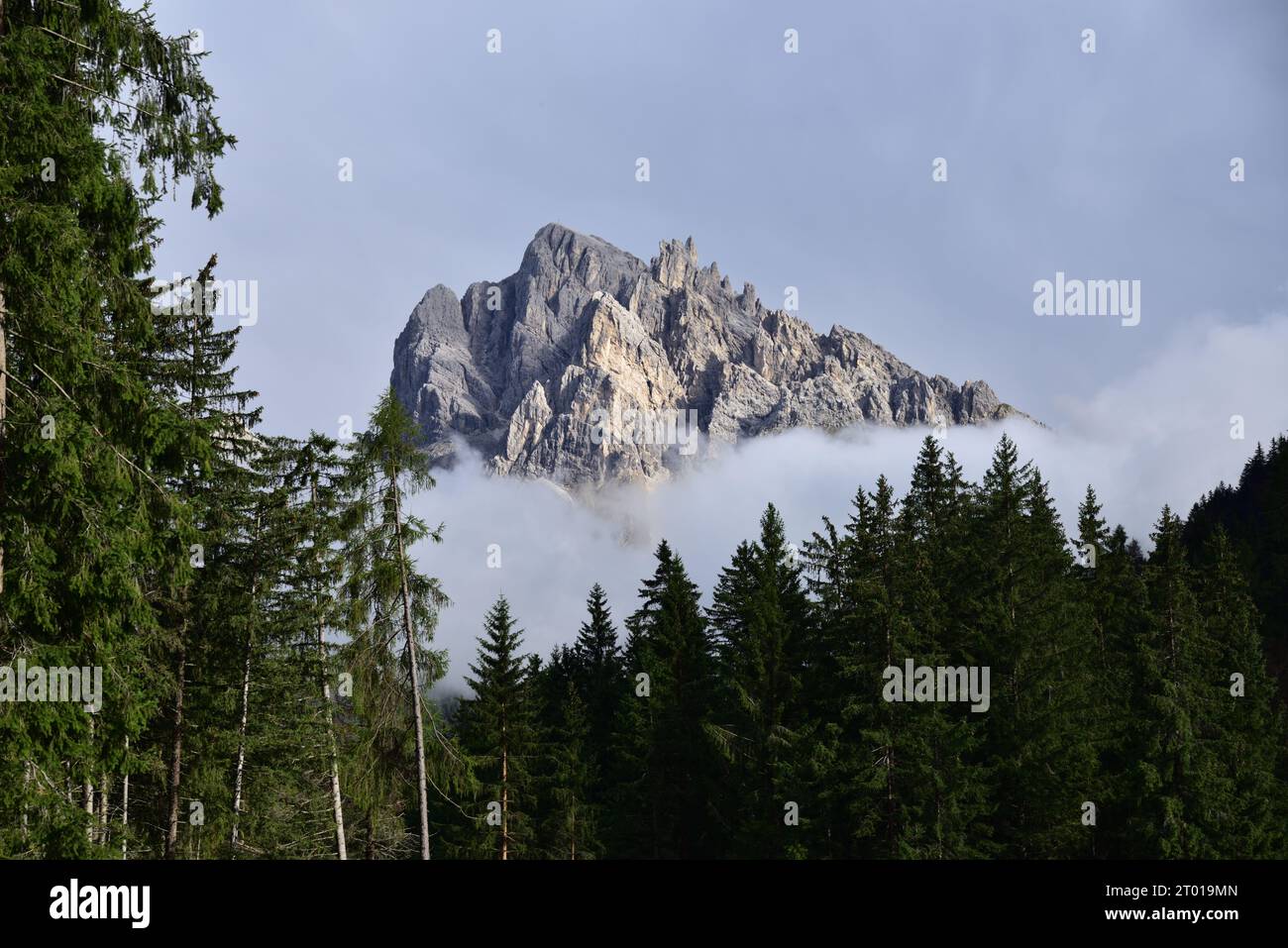 The sharp rocks of Picco Vallandro rise from the clouds of steam in the ...