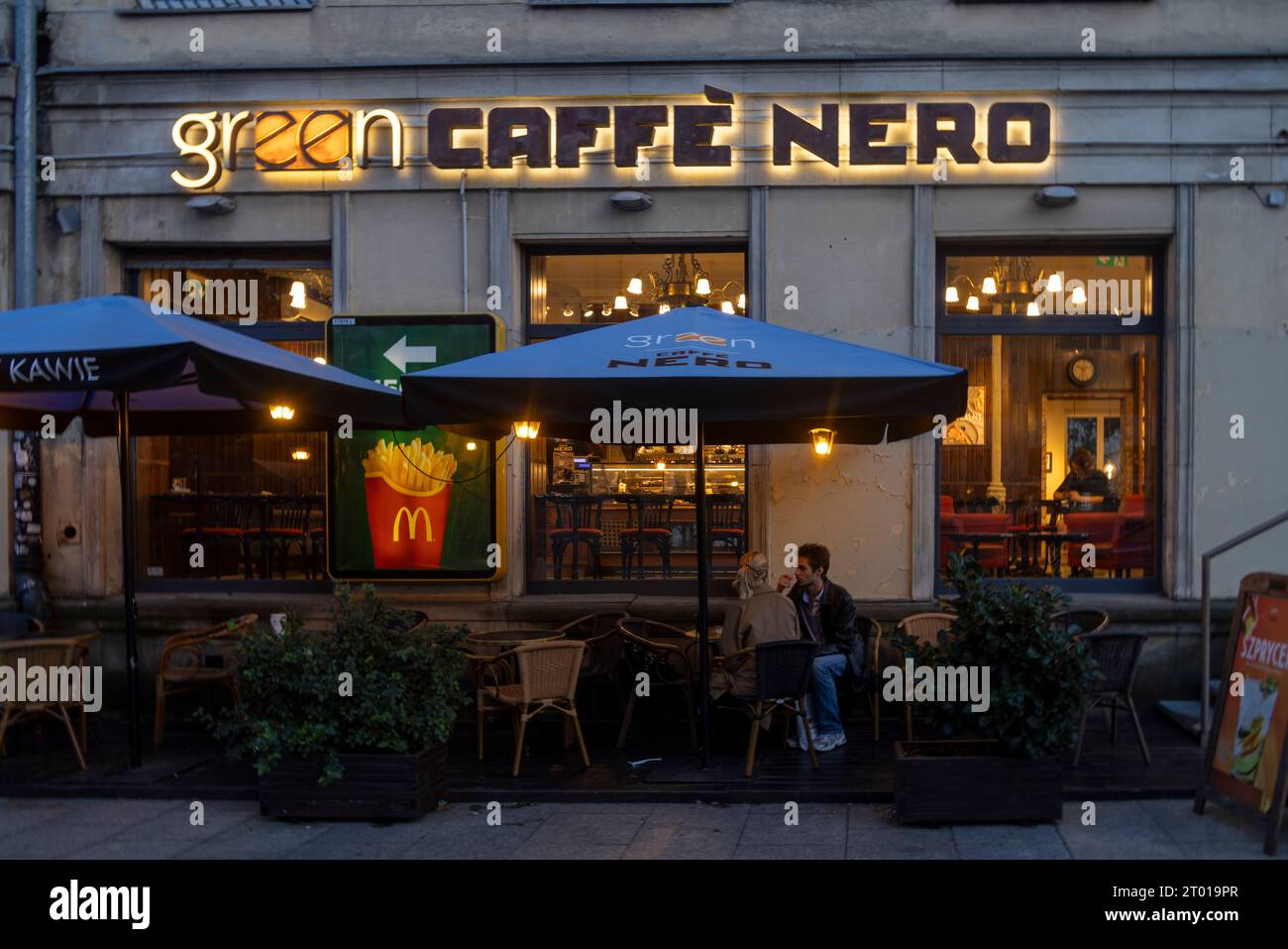 exterior of Green Caffe Nero on Royal Road, Warsaw Poland, at dusk ...