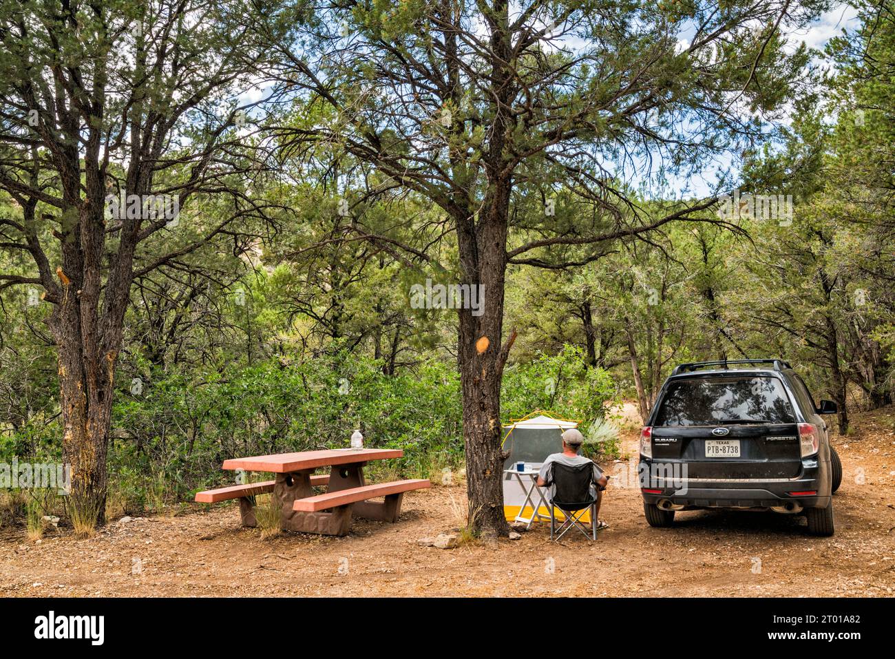 Camper at campsite at Indian Hollow Campground, Kaibab National Forest, near Little Saddle at ...