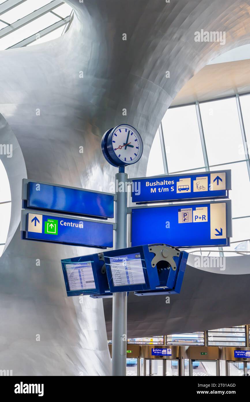 Bus departure and parking information sign with clock inside the ...