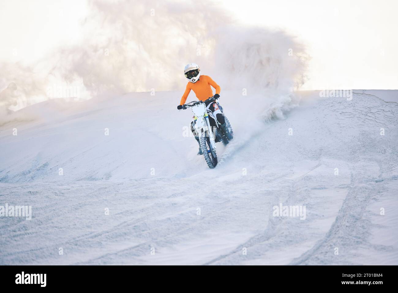 Motorcycle, desert dust and moto sport with athlete outdoor on hill ...