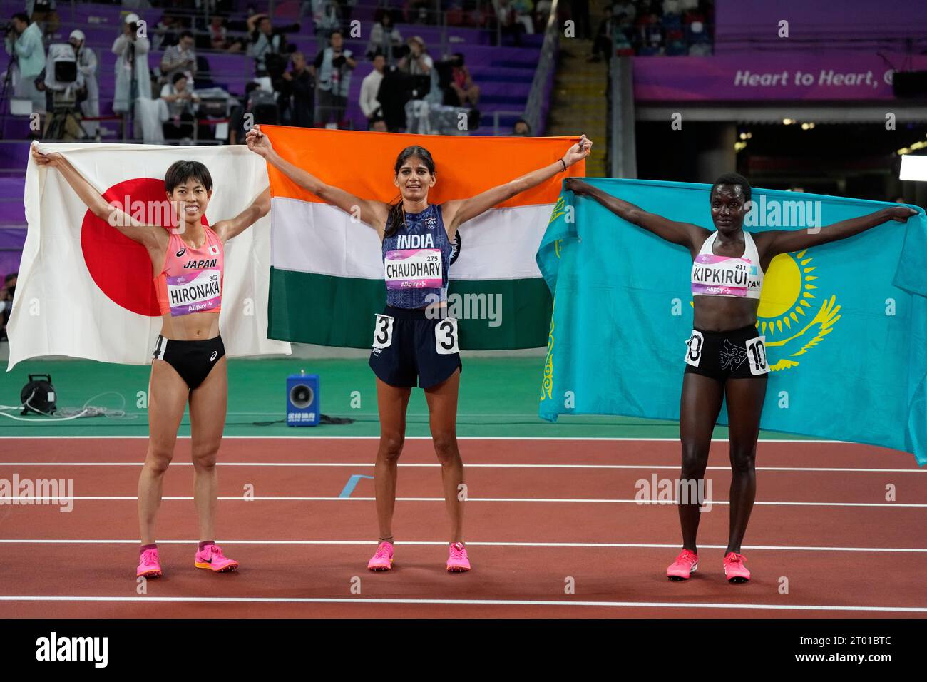 From left, silver medalist Japan's Ririka Hironaka, gold medalist India ...