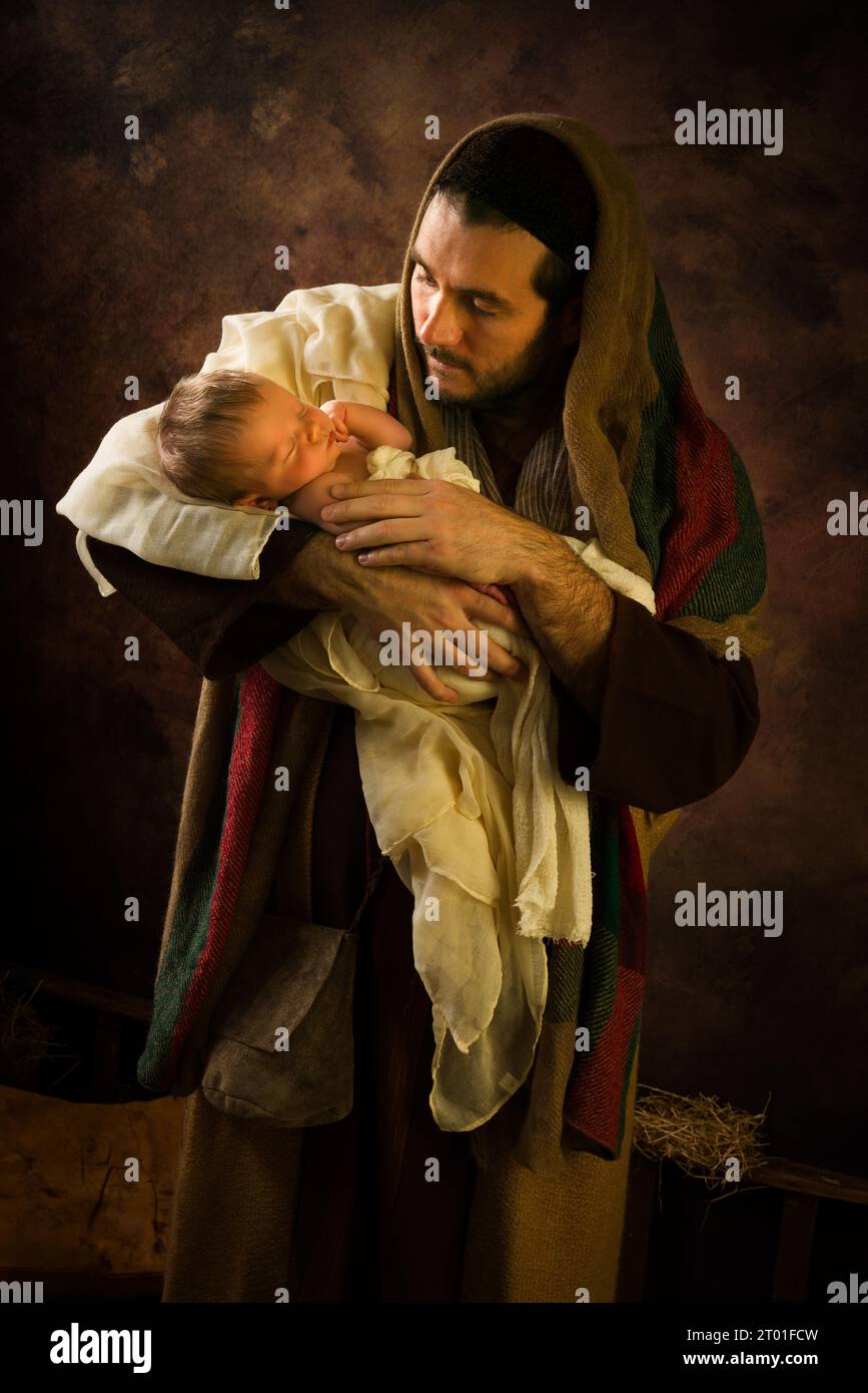 Proud Daddy playing Father Joseph with his own 8 days old son in a ...