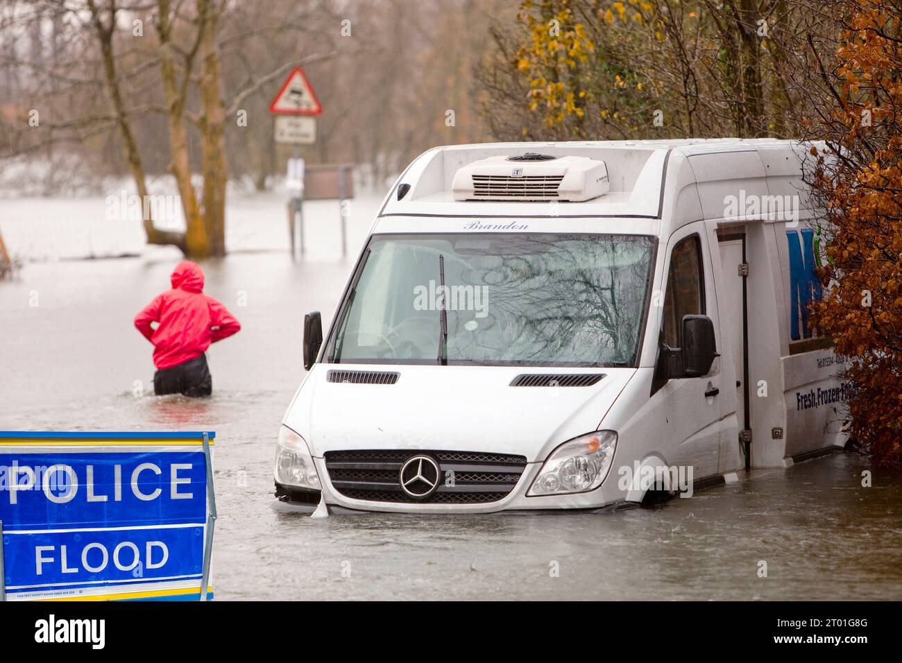 Walking home. The same extreme rainfall event washed away this van on ...