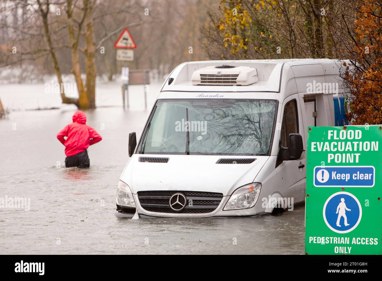 Walking home. The same extreme rainfall event washed away this van on ...