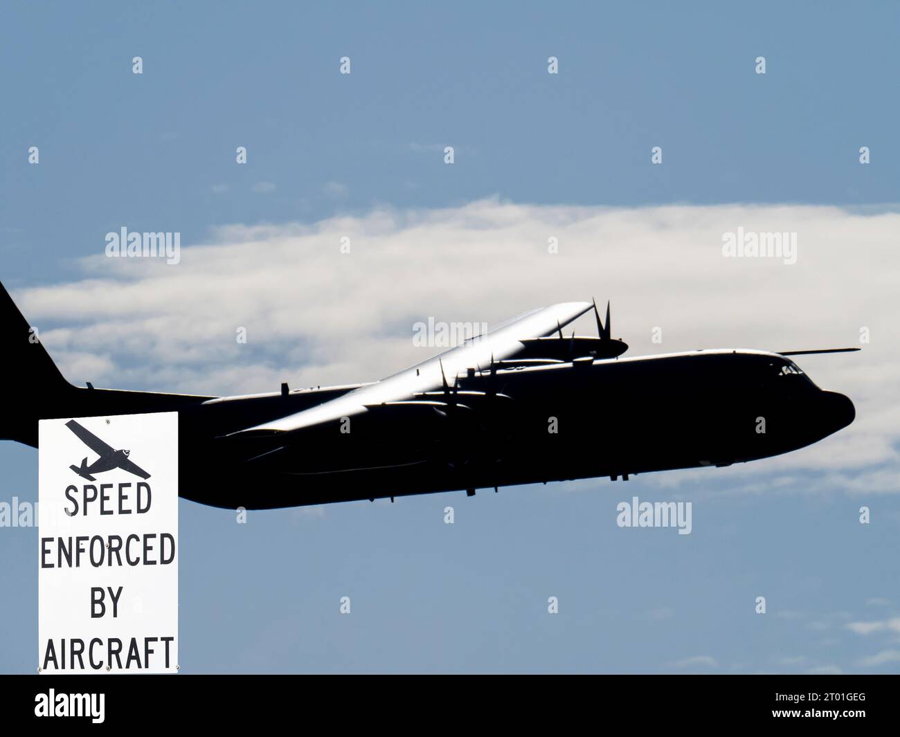 An RAF cargo plane flying over Ambleside in the Lake District, UK Stock ...