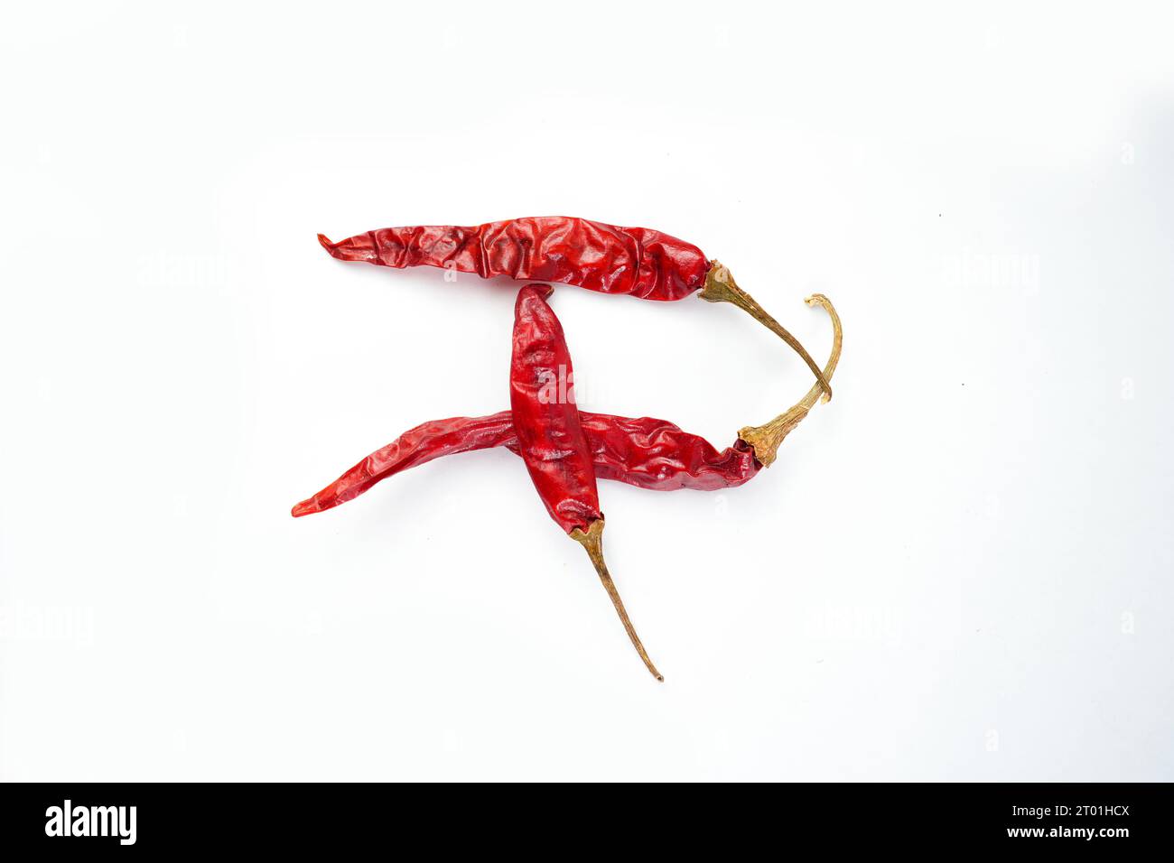 Red dried chilly in white background Stock Photo - Alamy