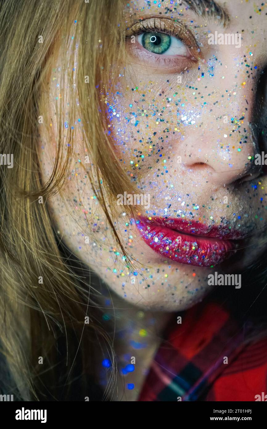 Shiny silver makeup on a woman's face. Beautiful young model girl with ...