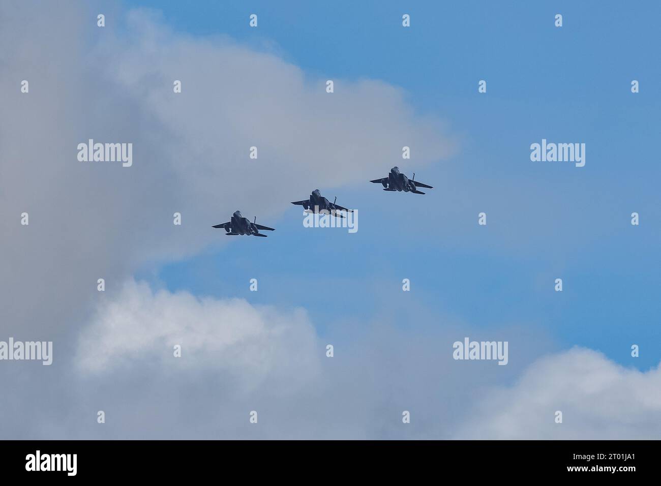 A trio of McDonnell Douglas F-15 Eagle in a close flying formation at ...