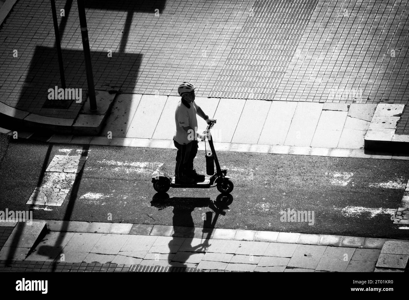 Man riding a scooter Black and White Stock Photos & Images - Alamy