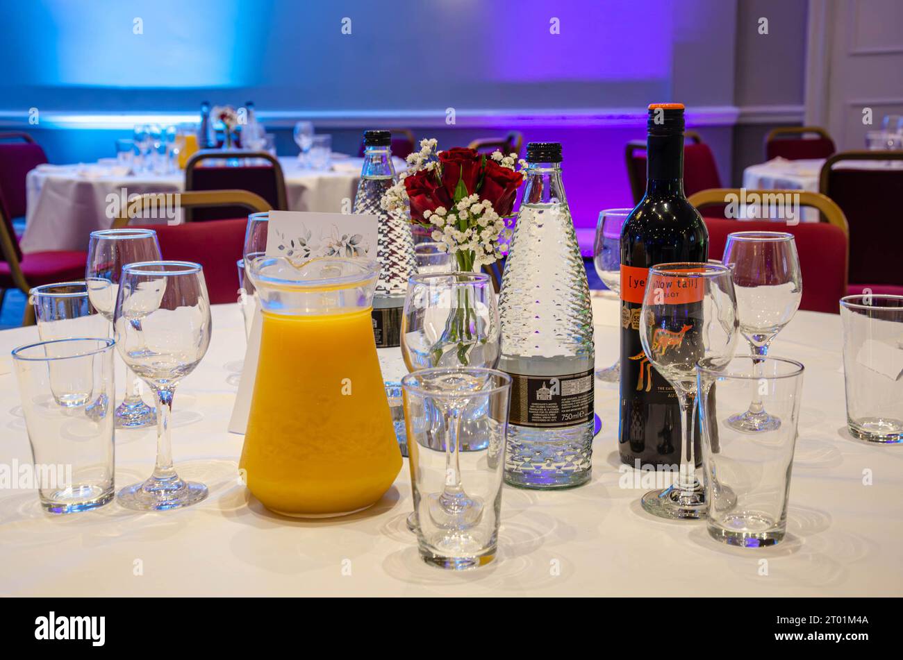 Drinks and glasses in the centre of a table for a party in a hotel ...