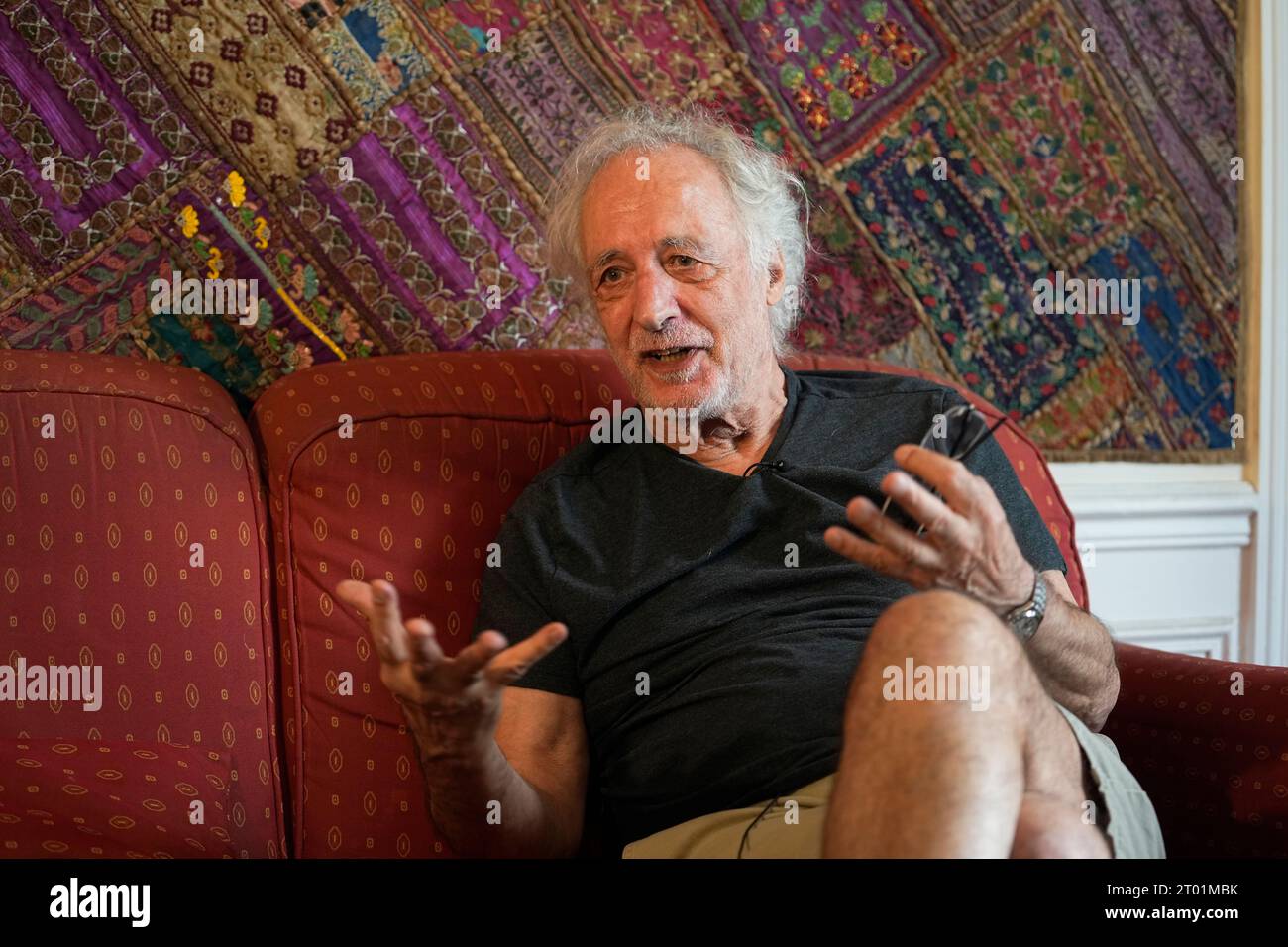 French scientist Pierre Agostini speaks in his apartment, Tuesday, Oct ...