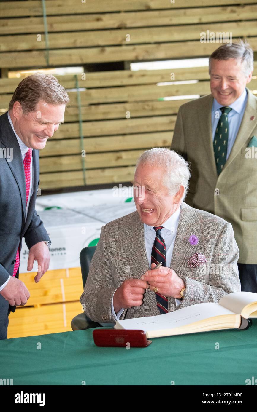 King Charles III signs the visitor book with Lord Lieutenant Sandy ...