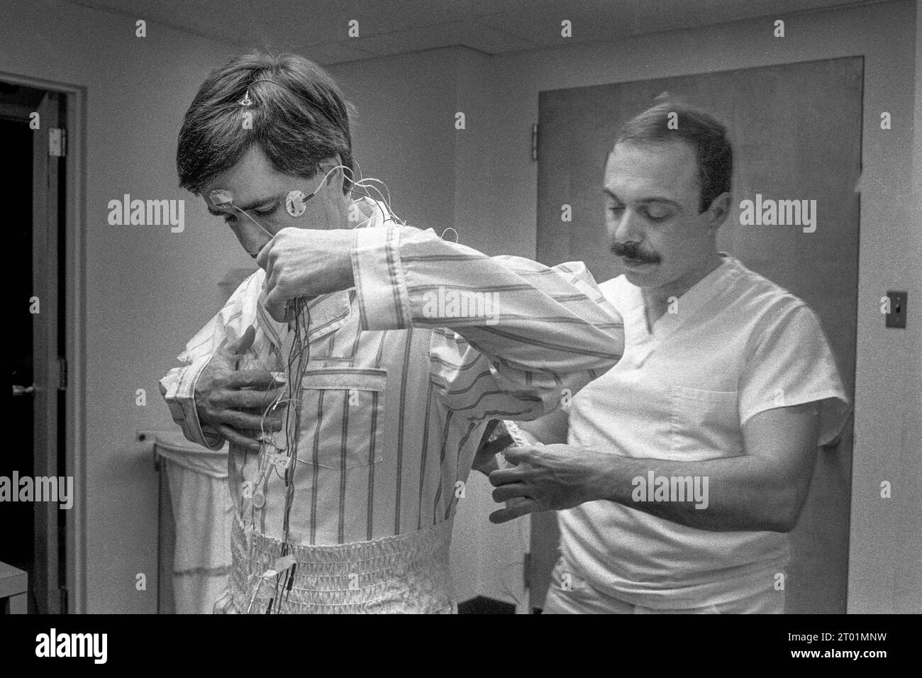 Sleep Technician Sam DeFrancesco places electrodes onto patient Lou ...