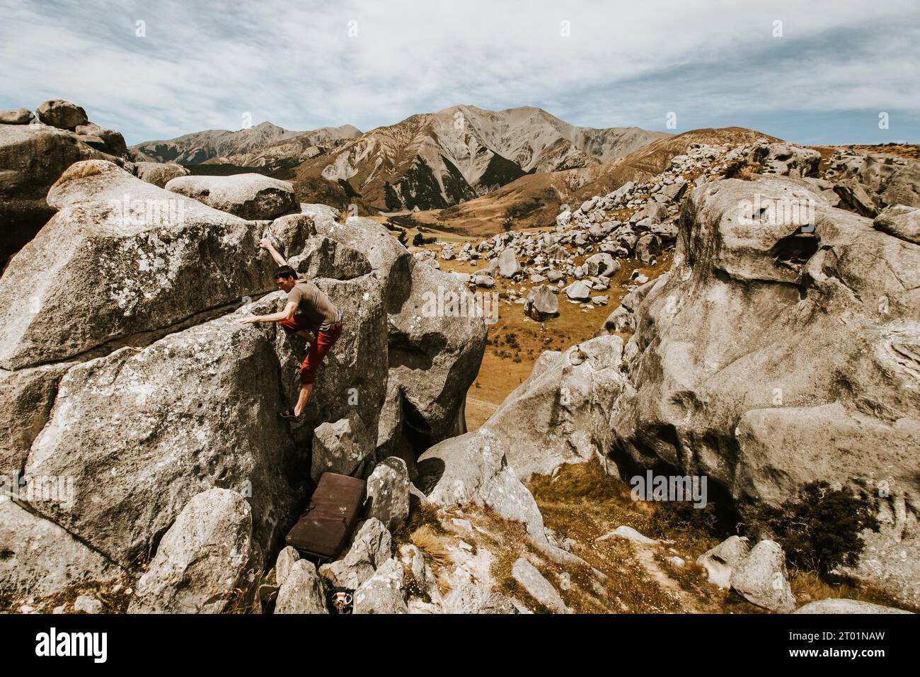 A man bouldering at Castle Hill, New Zealand Stock Photo - Alamy