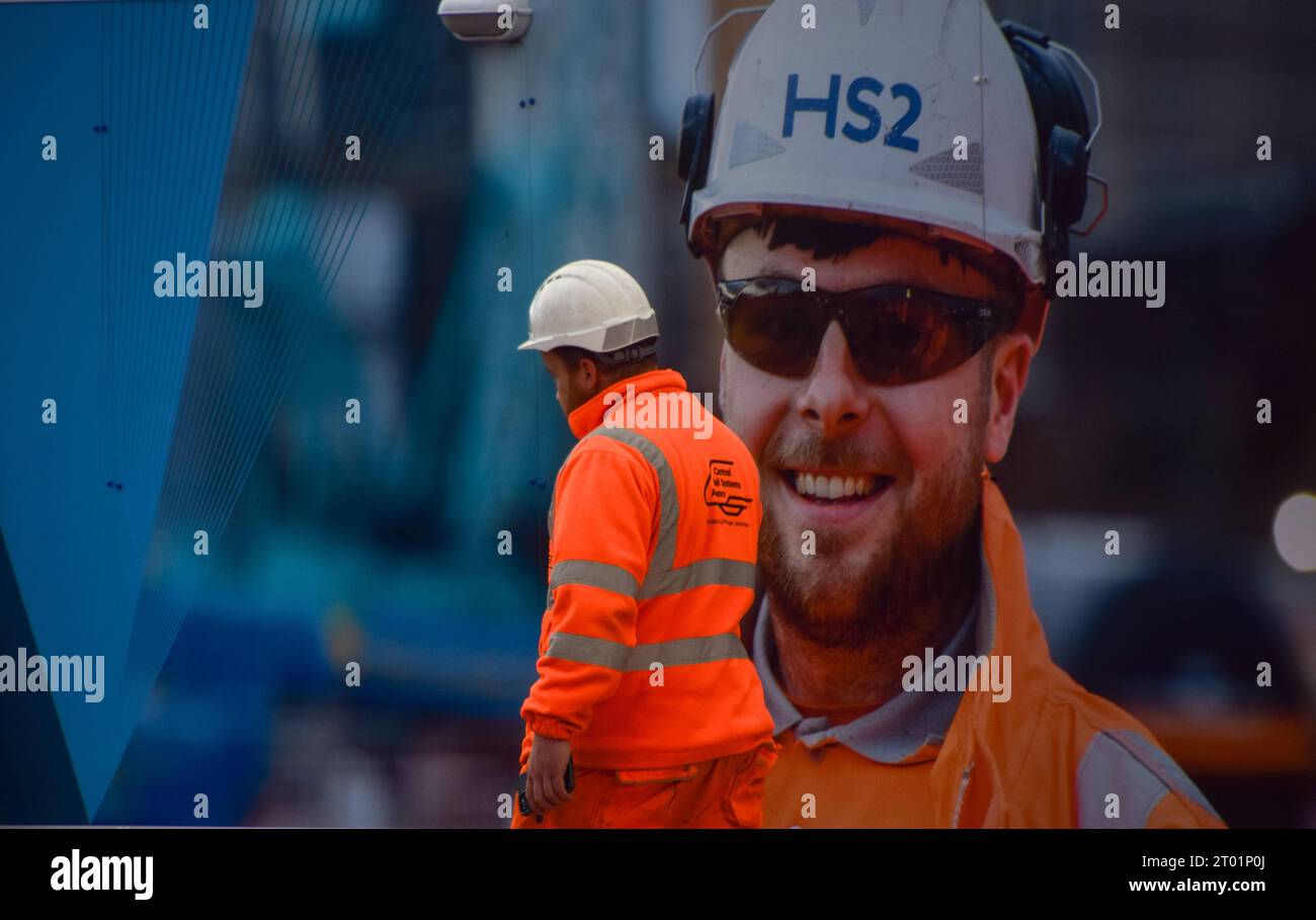 London, UK. 3rd October 2023. A worker walks past the HS2 construction ...