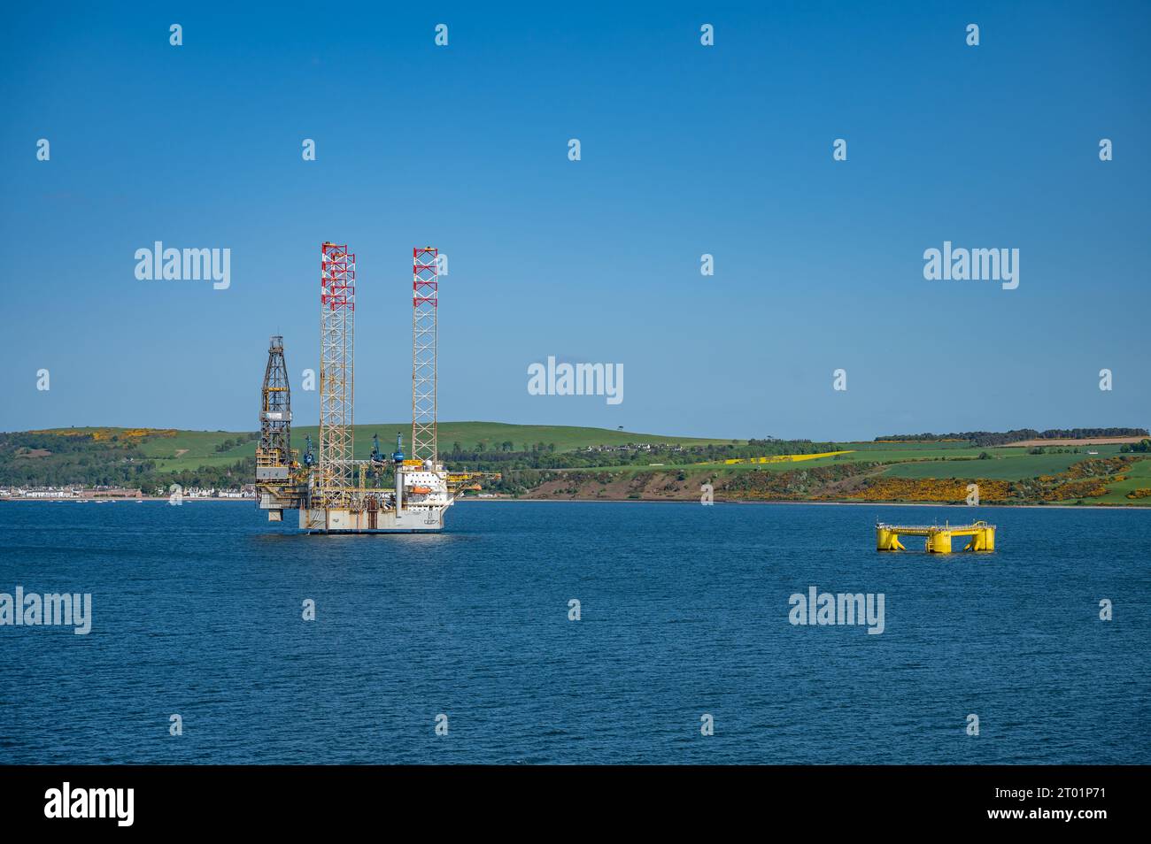 Industrial ship offshore wind turbine at the sea next to yellow ...