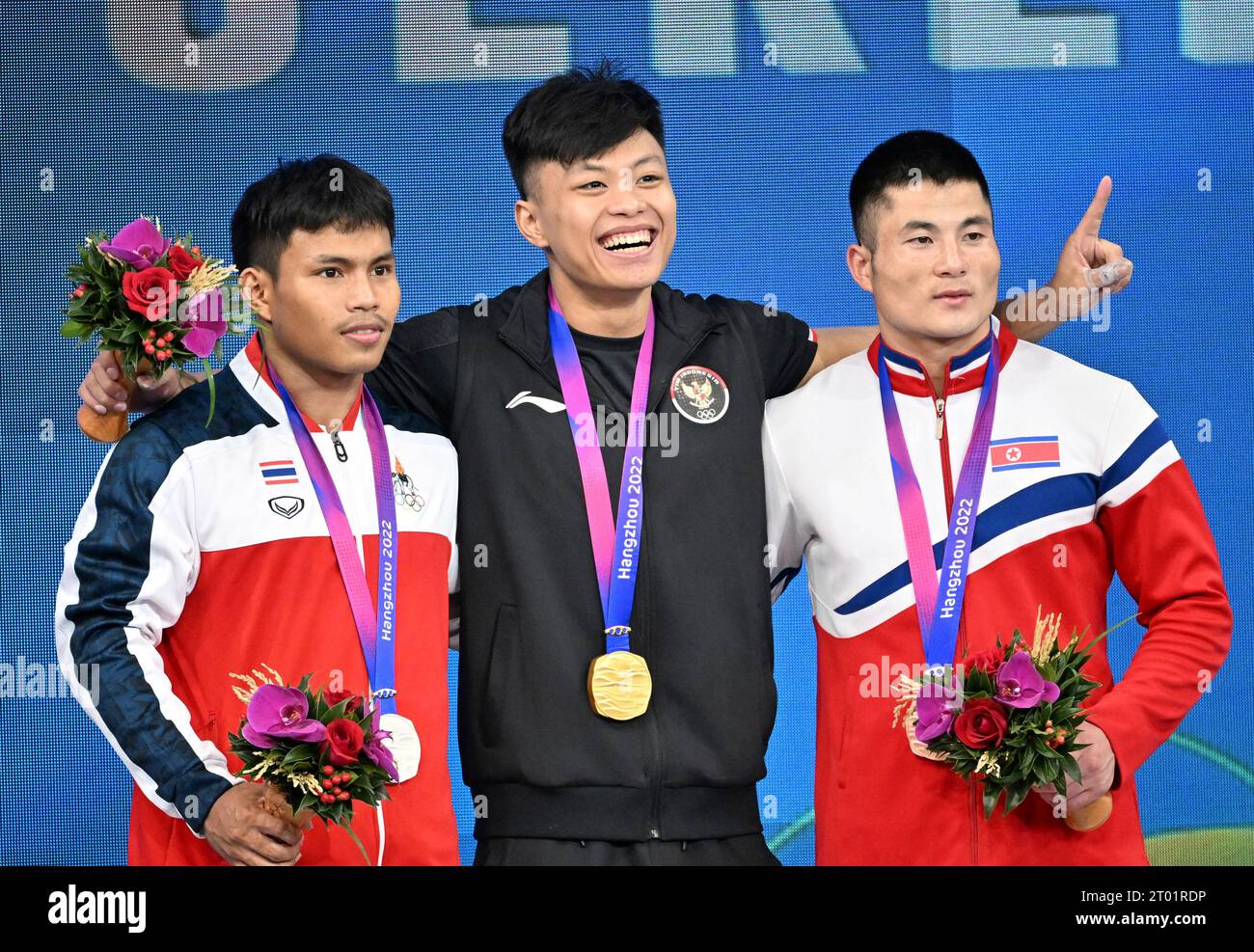ABDULLAH Rahmat Erwin of Indonesia (C) celebrates during an award ...